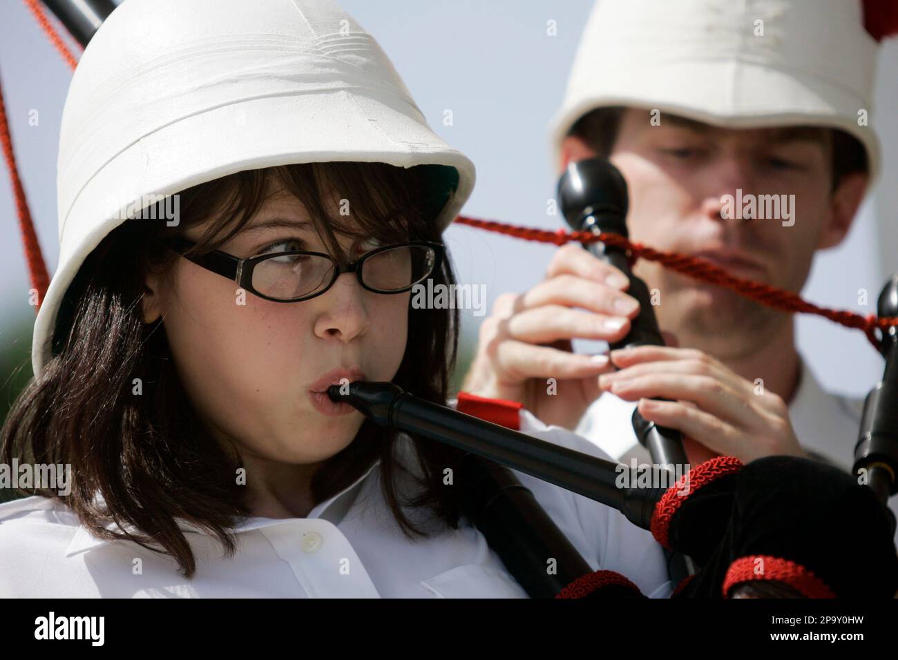 Emma Beers, left, 14, a member of the St. Andrew's Pipe Band of Miami ...