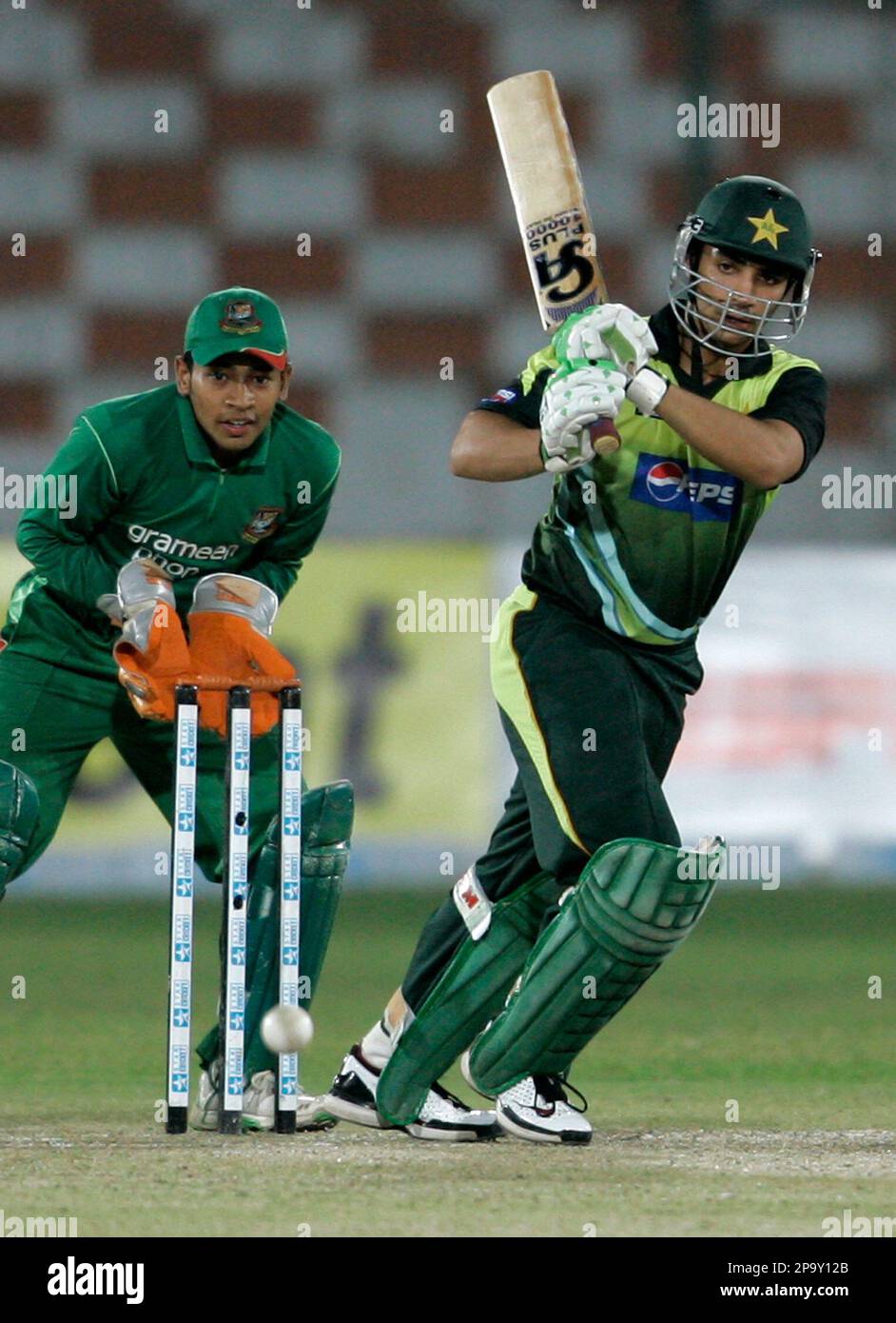 Pakistani batman Salman Butt plays a shot as Bangladeshi wicketkeeper ...