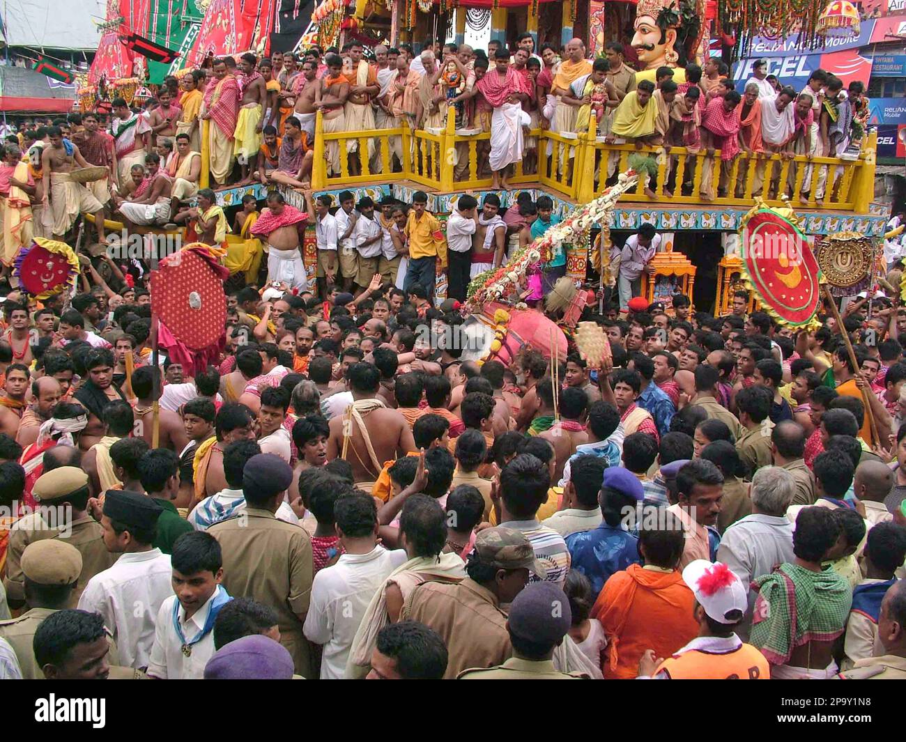 Devotees throng around a chariot during the Rath Yatra, or Chariot ...