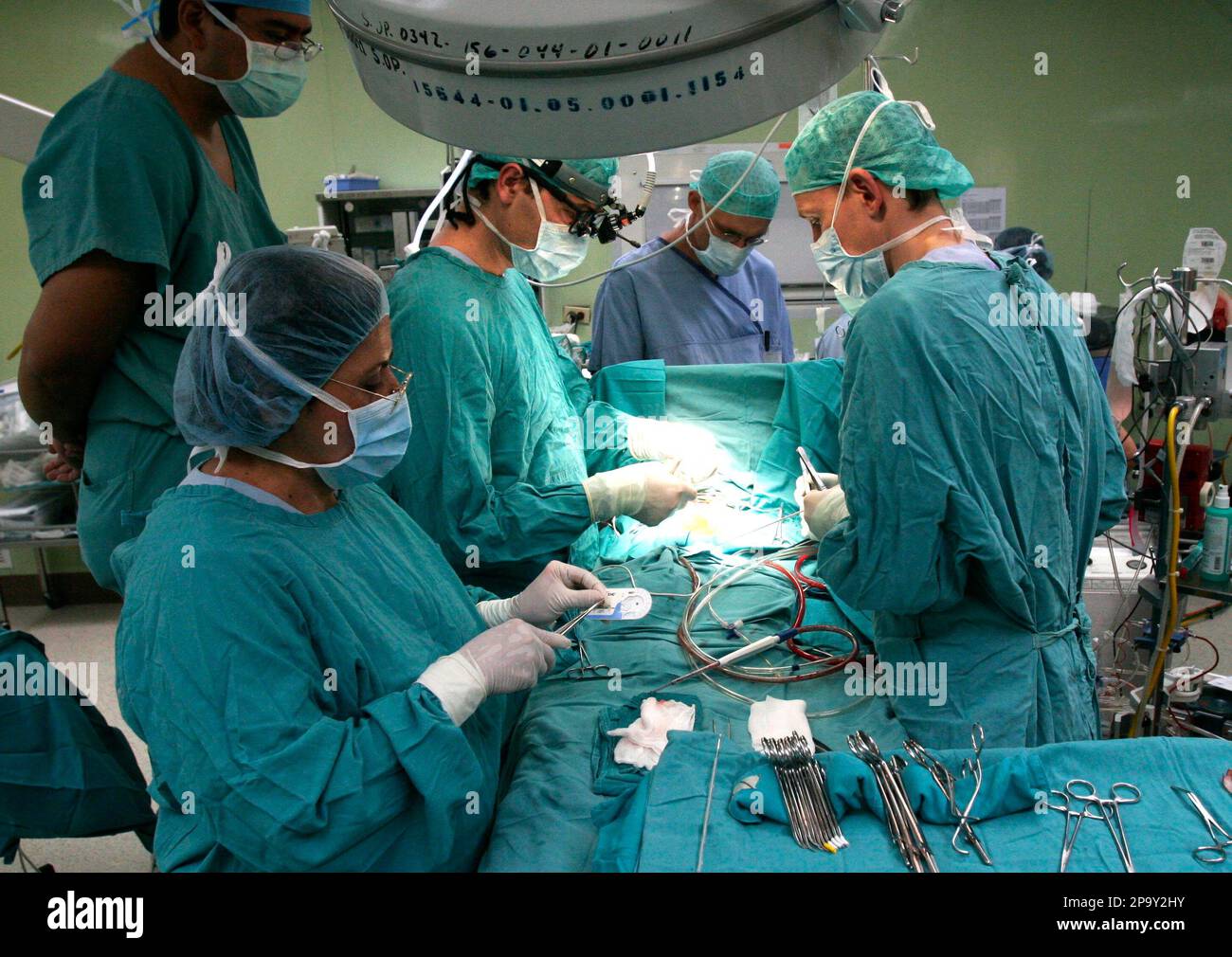German surgeon Christian Schlenzak, third from left, and his team ...