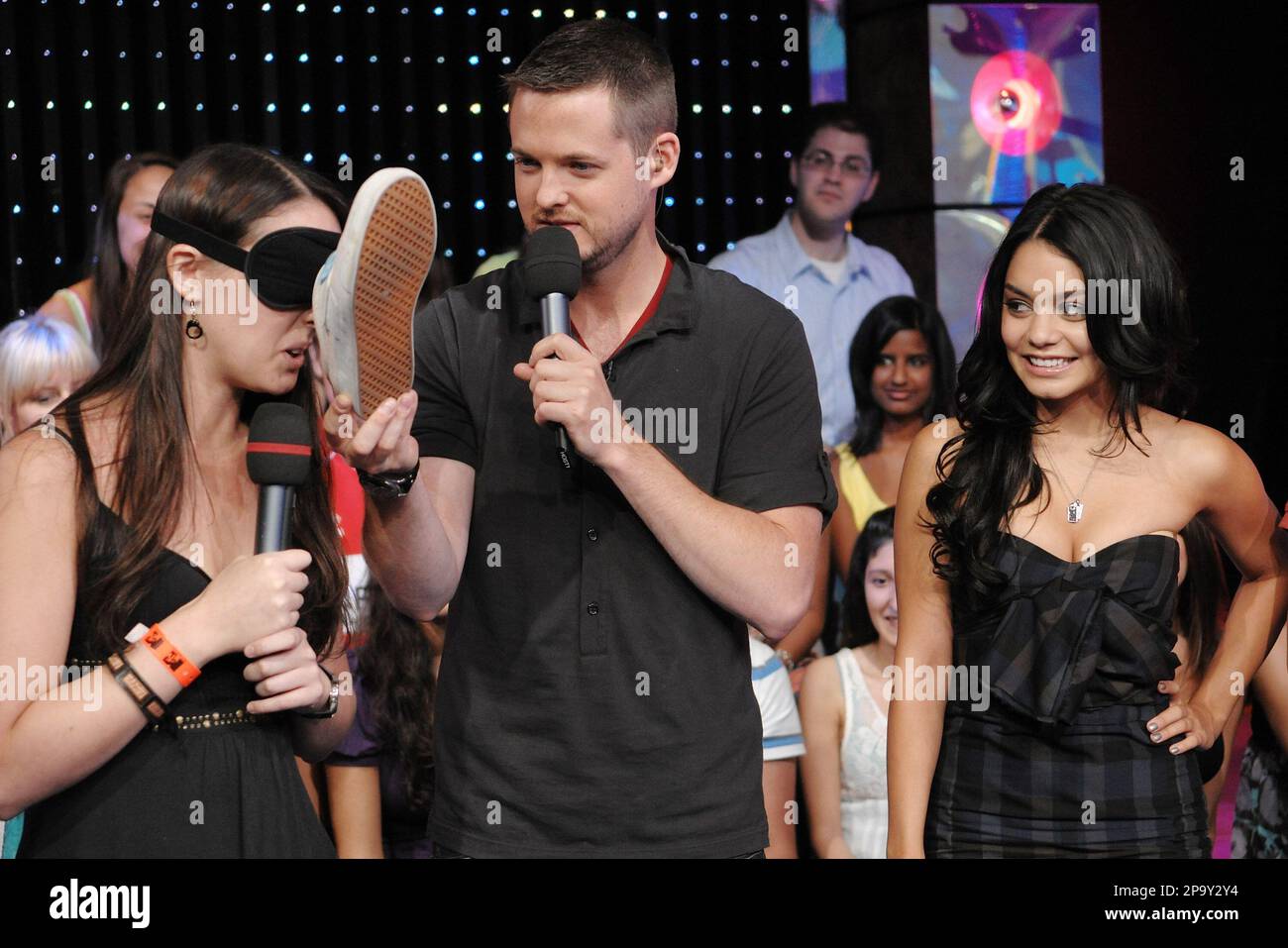 Actress-singer Vanessa Hudgens, far right, looks on as VJ Damien Fahey ...