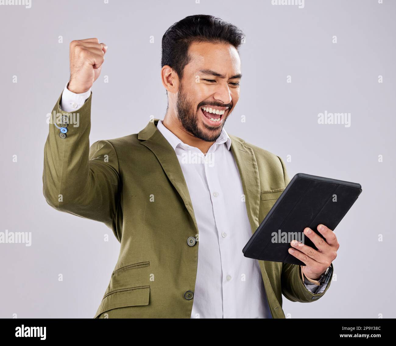 Asian man, tablet or success fist on isolated studio background for ...