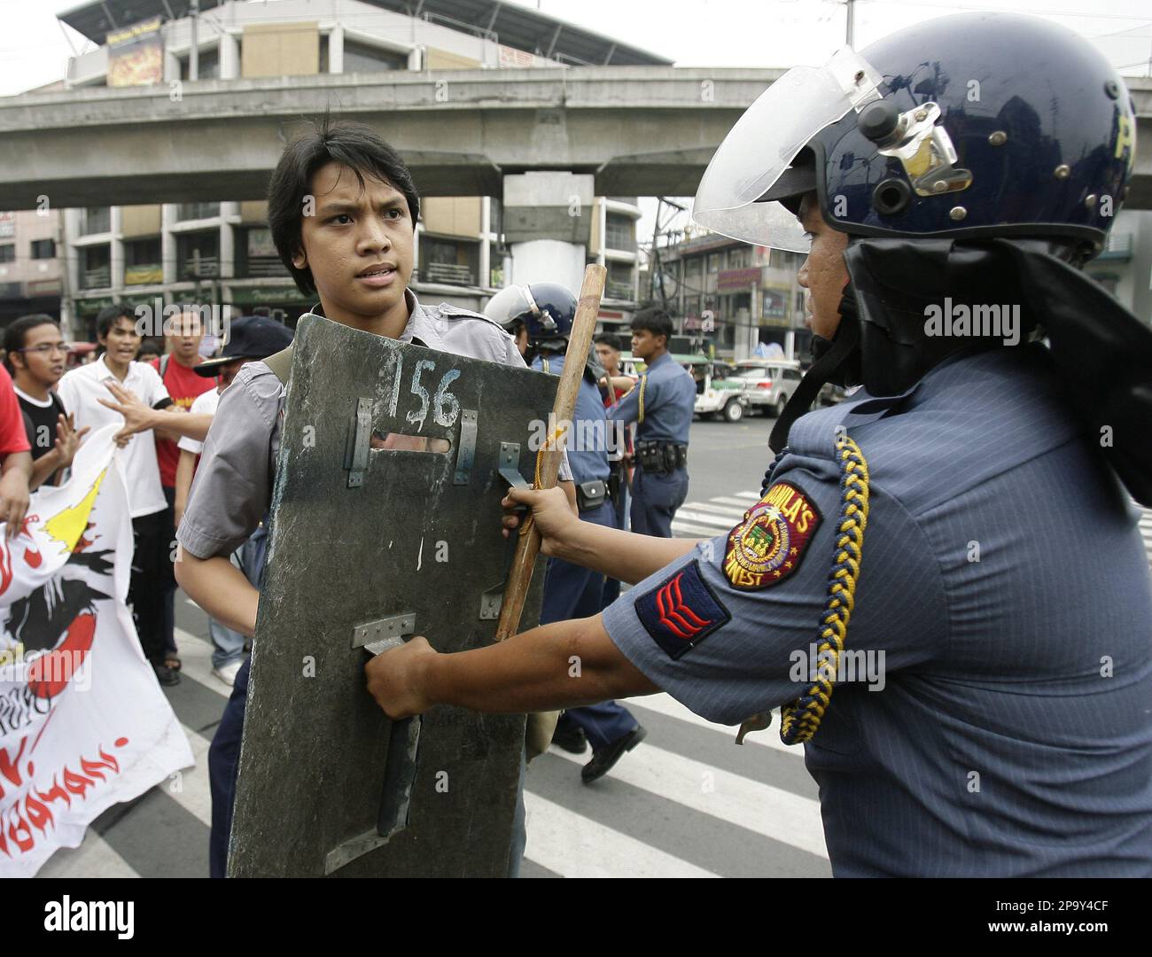 Philippine anti-riot police block student activists during a protest ...