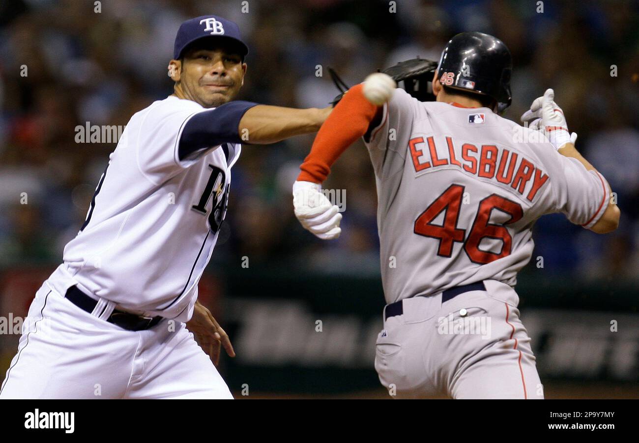 Boston Red Sox runner Jacoby Ellsbury (46) gets hit with the ball thrown by Tampa Bay Rays ...
