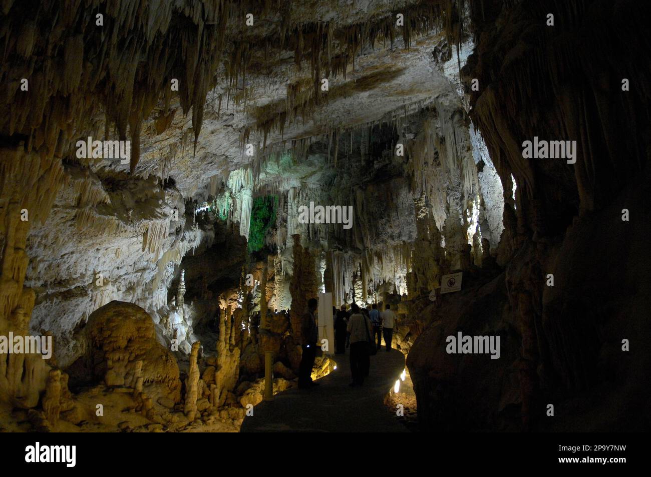 Journalists take a tour in the upper cave of the Jeita Grotto during a ...