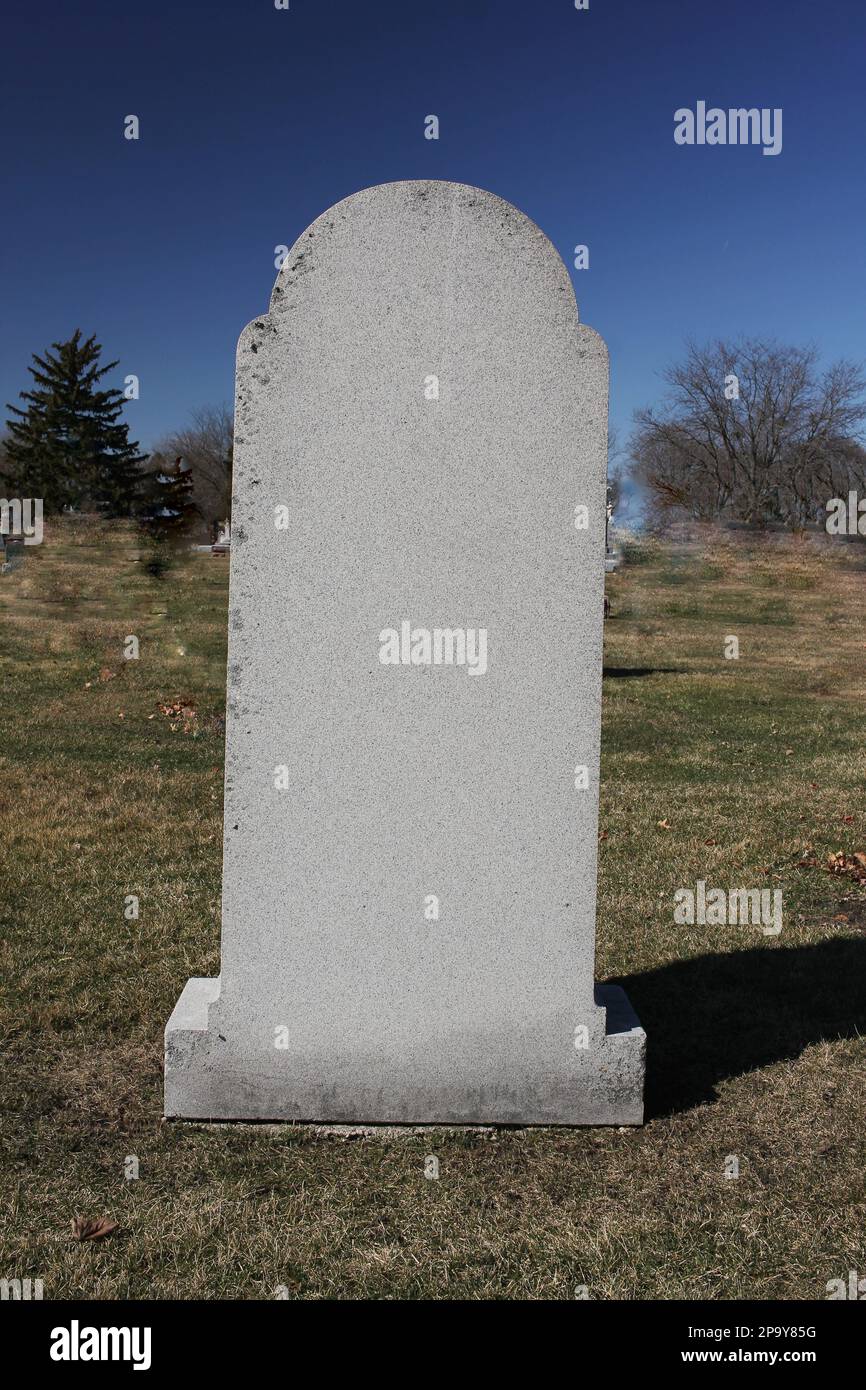 A tombstone with a worn and weathered blank epitaph with room for text ...