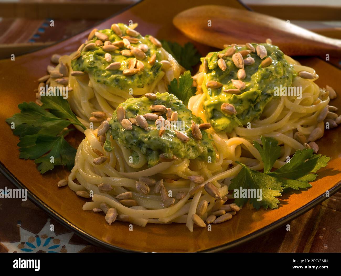 Pasta with herbs and sunflower seeds Stock Photo - Alamy