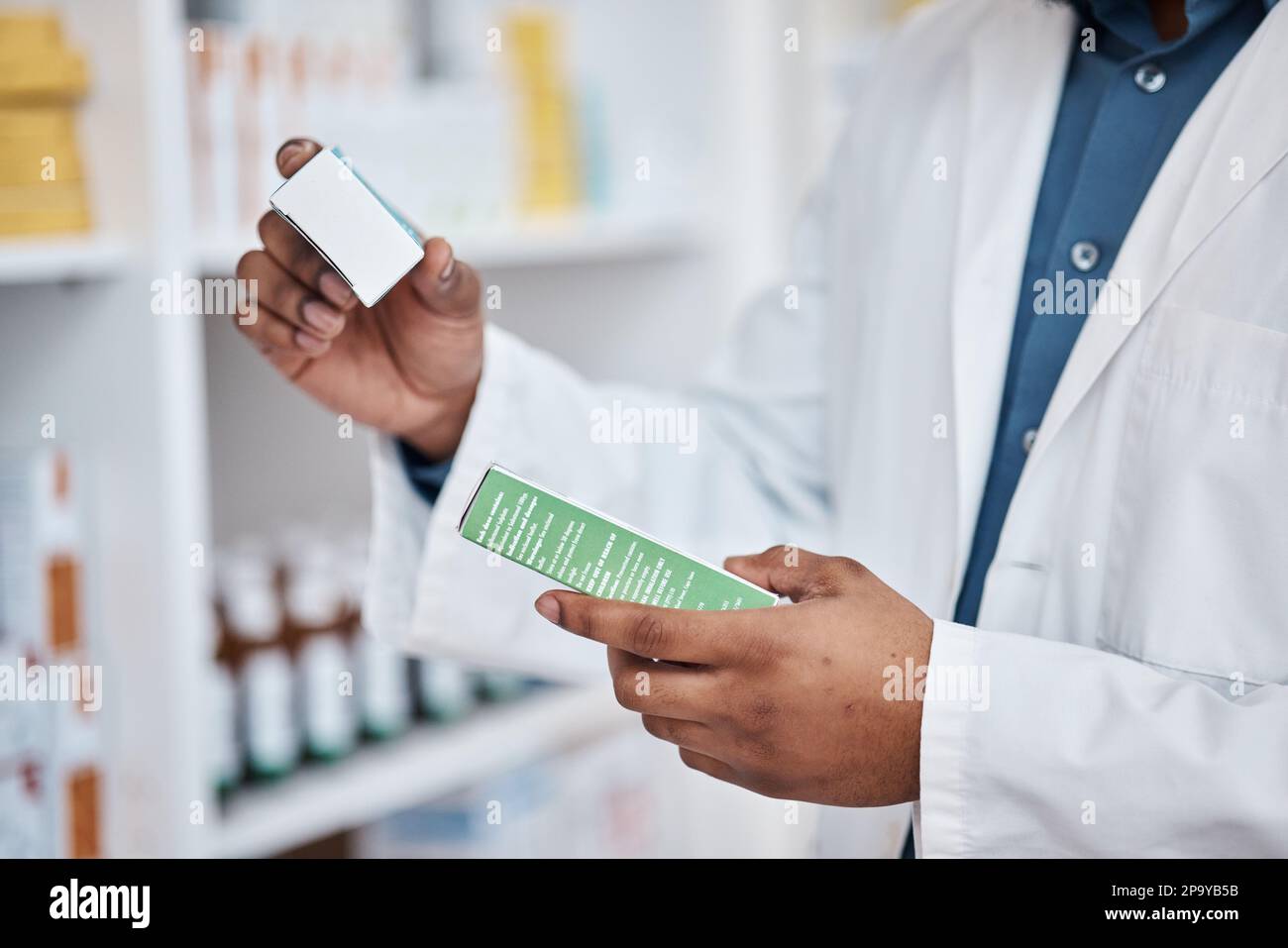 Chemist checking drugs shelf hi-res stock photography and images - Alamy