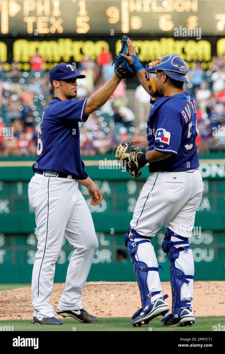Texas Rangers relief pitcher C.J. Wilson, left, and catcher Max Ramirez ...