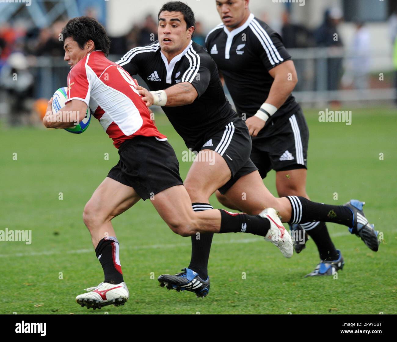 Japan's Tomoki Yoshida, left, is chased by New Zealand Maori Tamati ...