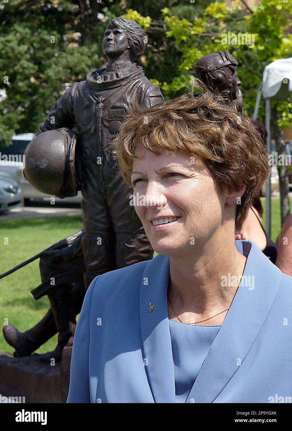 Col. Eileen Collins stands close to her likeness in the Harold Holden ...