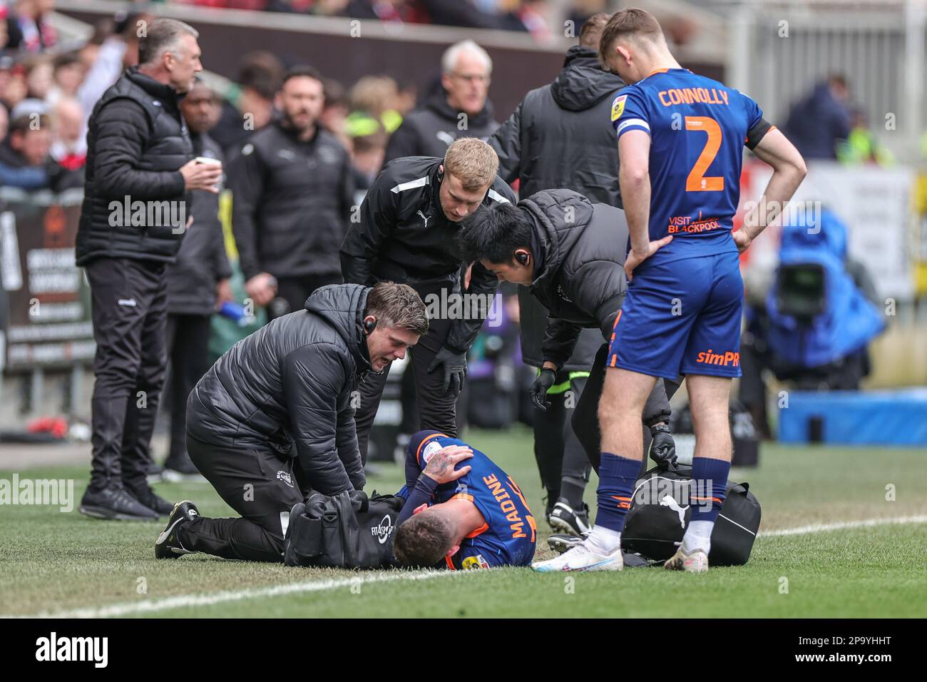 Gary Madine #14 of Blackpool receives treatment during the Sky Bet ...