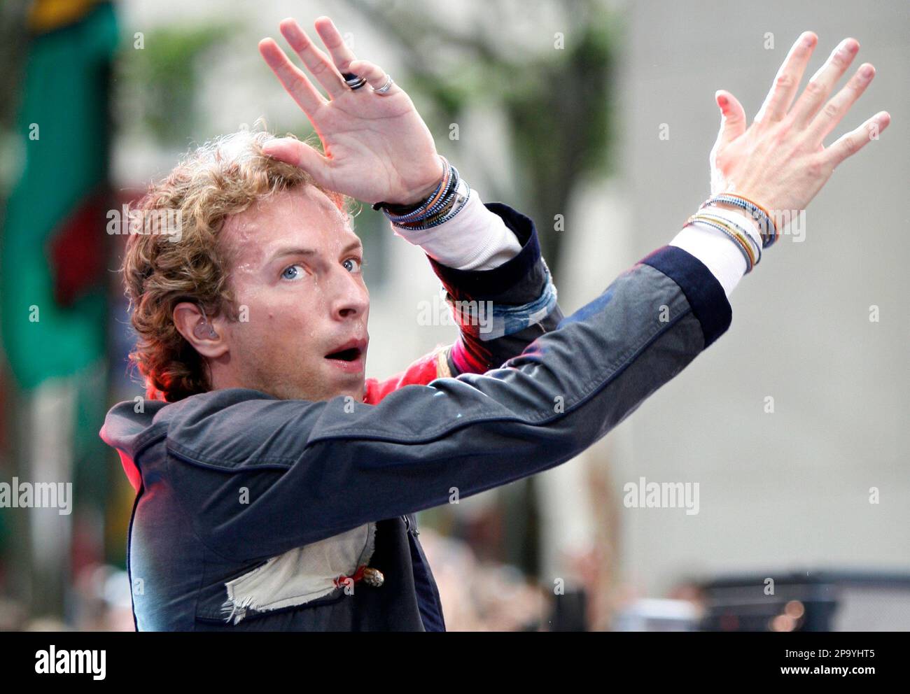Chris Martin, lead singer of Coldplay, performs with the group on the ...