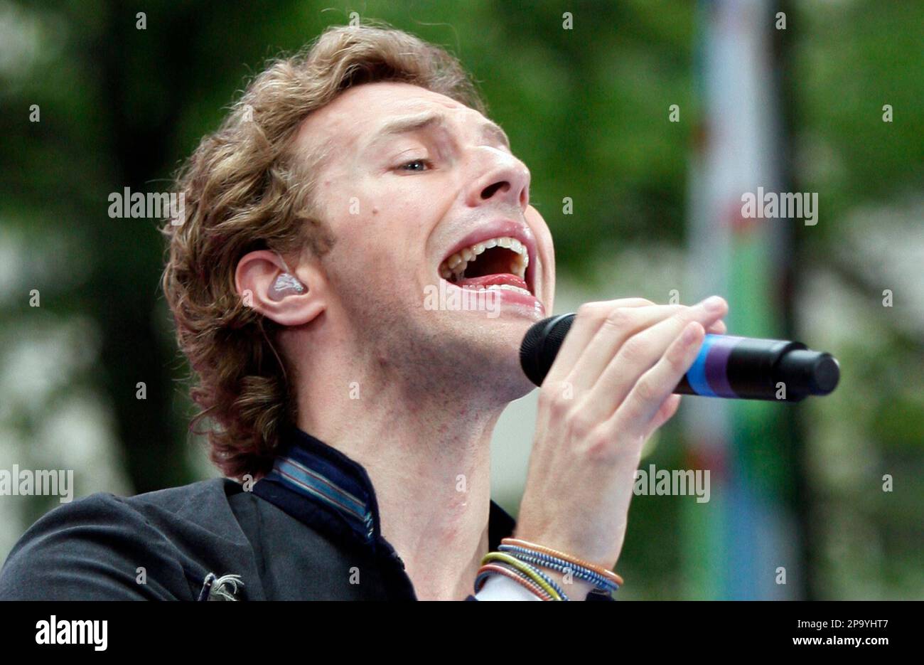 Chris Martin, lead singer of Coldplay, performs with the group on the ...