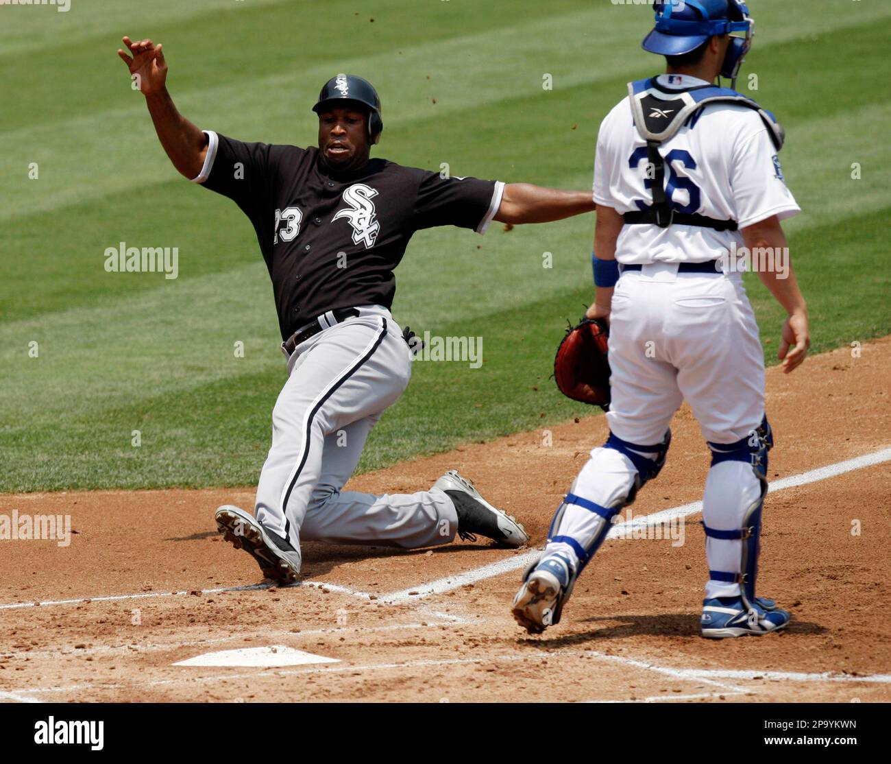 Chicago White Sox's Jermaine Dye, left, scores as Los Angeles Dodgers ...