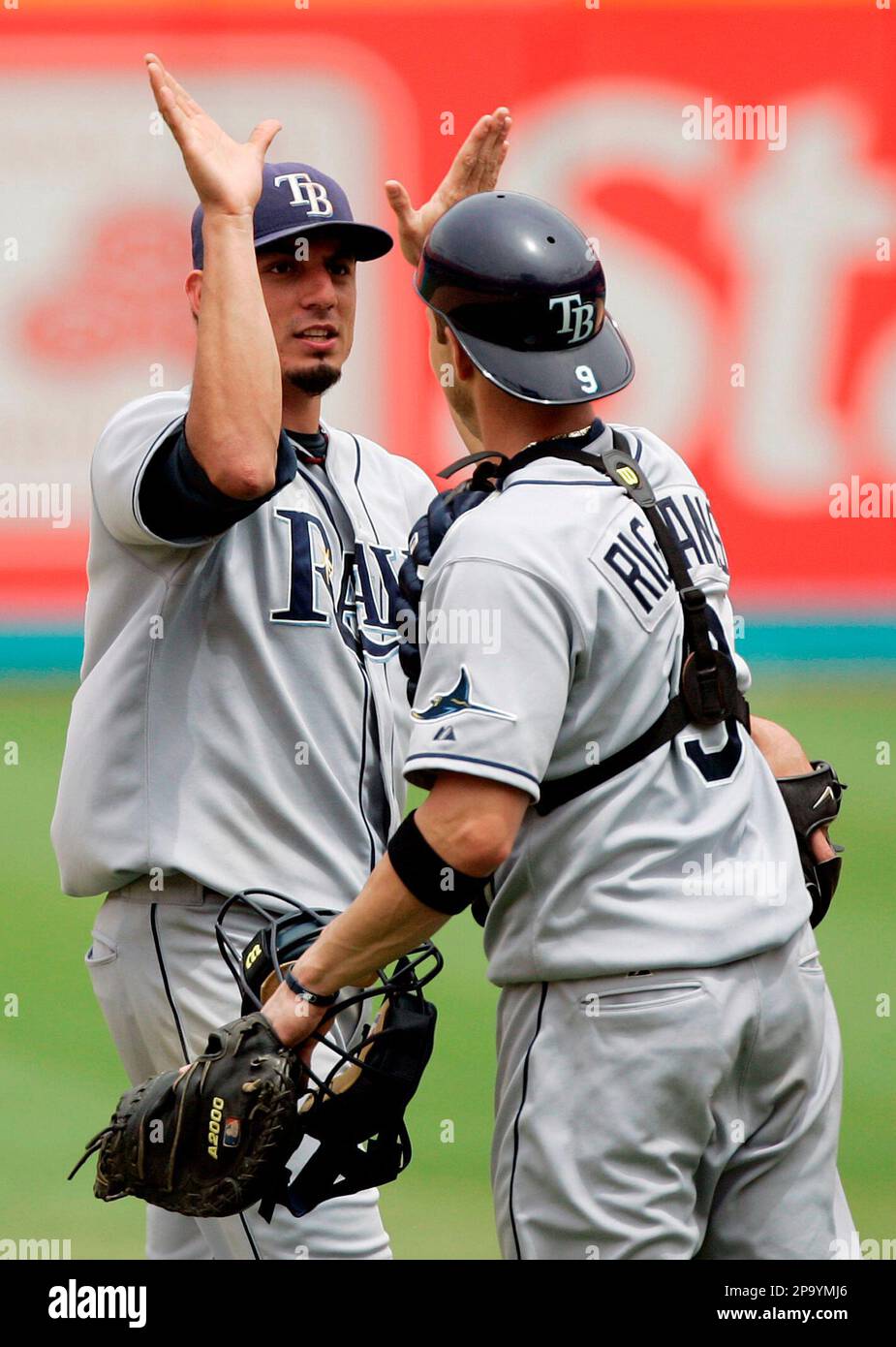 Tampa Bay Rays' Matt Garza, left, gets a high-five from his catcher ...