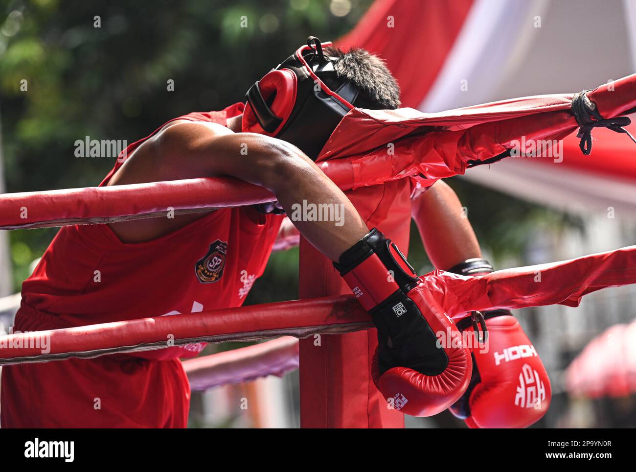 Jakarta, Indonesia. 11th Mar, 2023. An amateur boxer takes a rest after ...