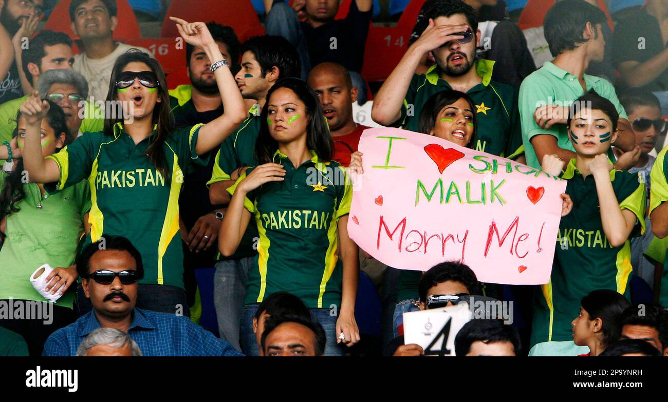 Pakistani cricket fans cheer during a cricket match between Pakistan ...