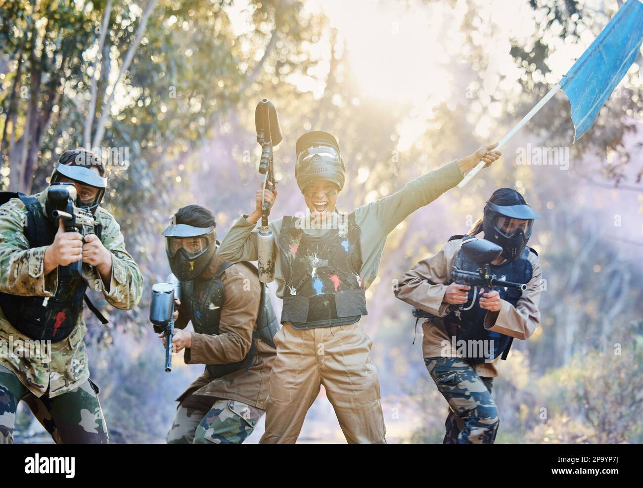 Teamwork, paintball and capture the flag in celebration for winning ...