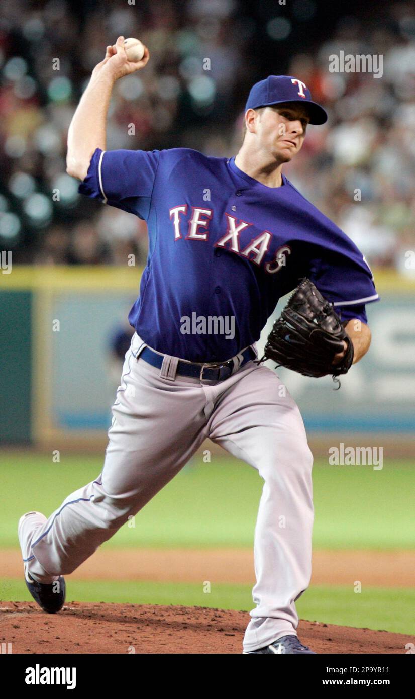 Texas Rangers' Scott Feldman delivers a pitch in the first inning ...