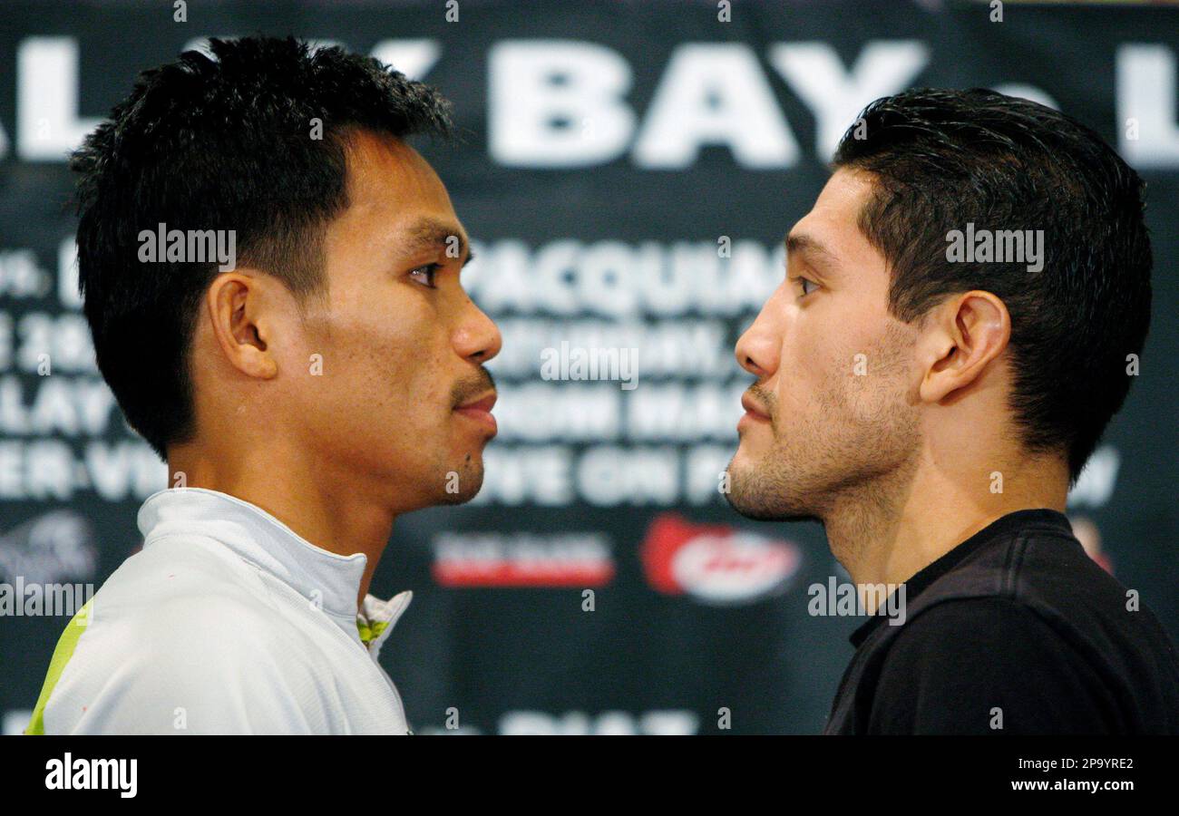 WBC lightweight boxing champion David Diaz, right, and Manny Pacquiao, of the Philippines, pose ...