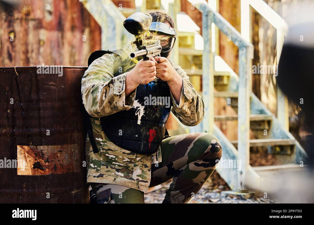 Paintball, military or man with gun in shooting game playing with on ...