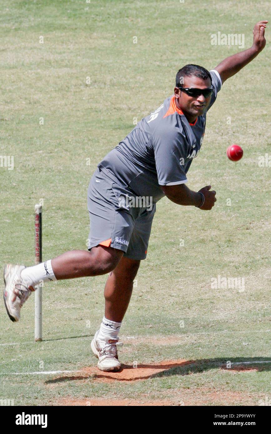 Indian cricketer Ramesh Powar bowls in the nets during a training camp ...