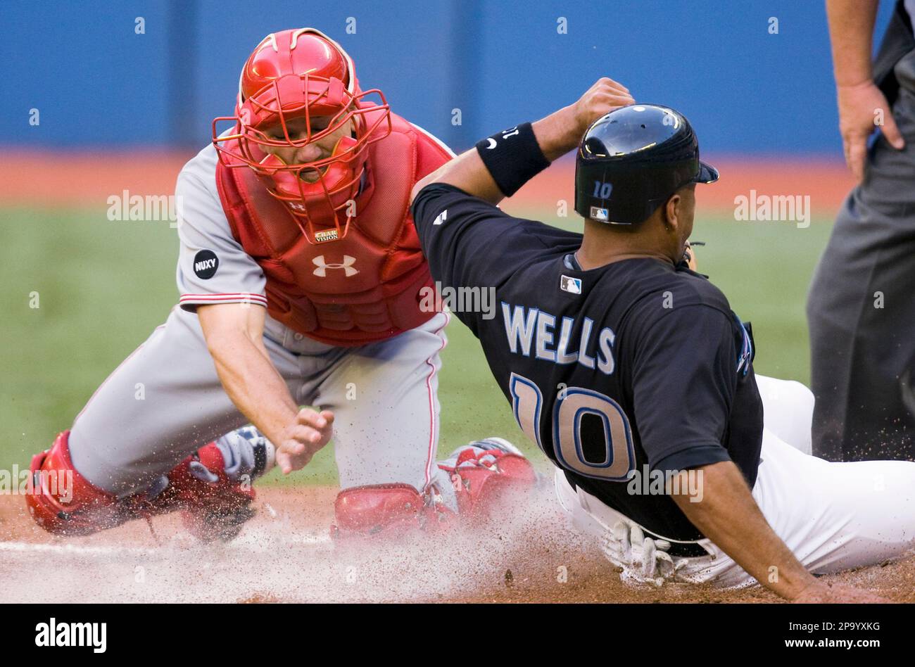 Toronto Blue Jays' Vernon Wells, right, slides safely into home past ...
