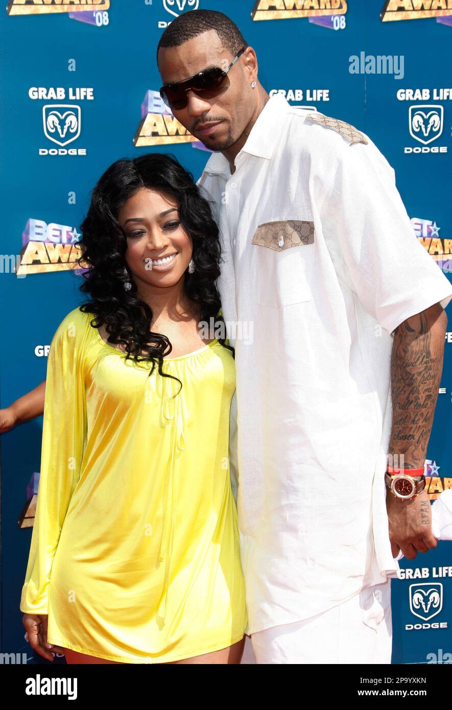NBA basketball player Kenyon Martin, right, and Trina arrive at the BET ...