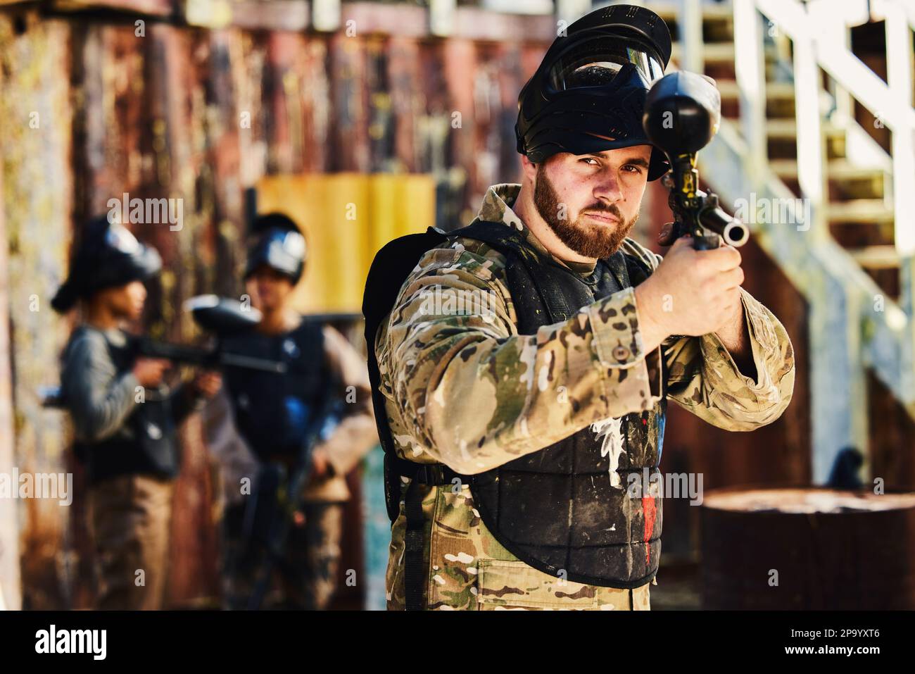 Paintball, target or portrait of man with gun in shooting game playing ...