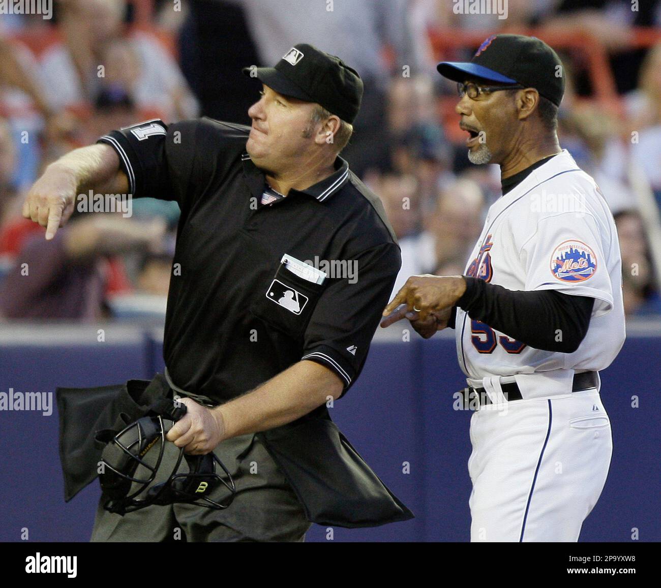 Home plate umpire Brian Runge, left, ejects New York Mets manager Jerry ...