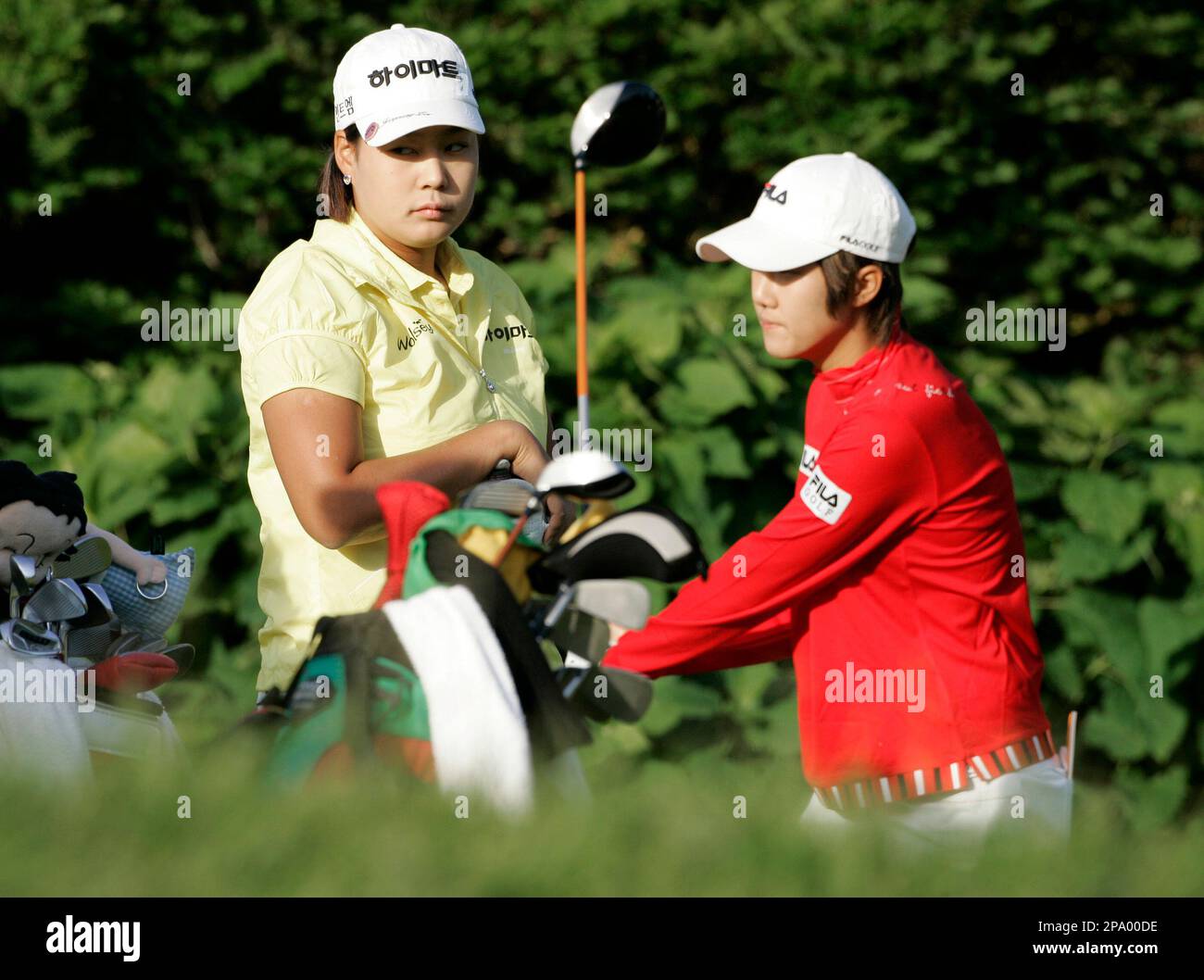 Sun Young Yoo, left, and Jee-Young Lee, both of South Korea, wait to ...