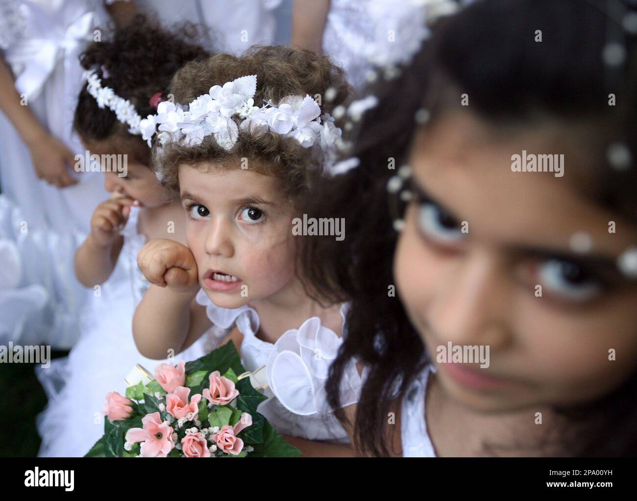 Girls dressed in wedding dress attends the celebrations of the Orthodox ...