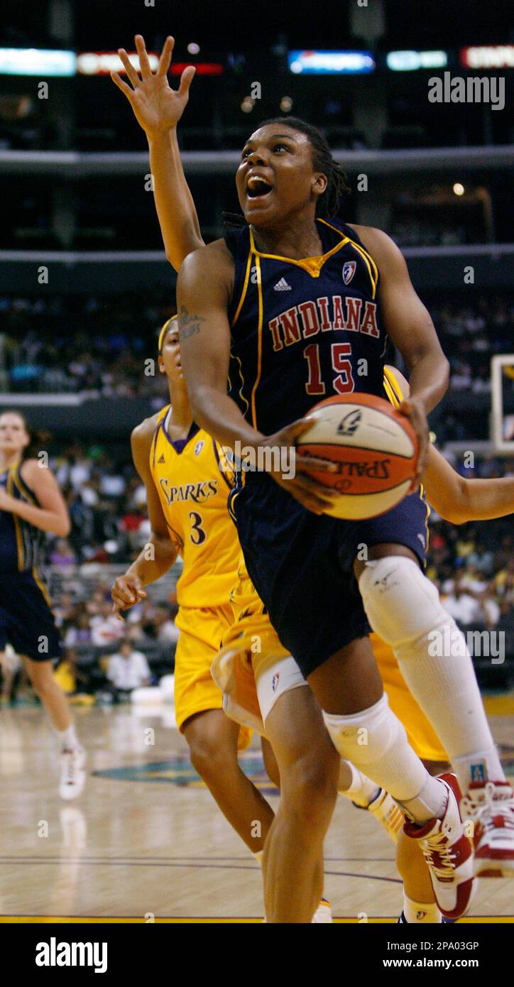 Indiana Fever's Tan White (15) drives to the basket in the first half ...