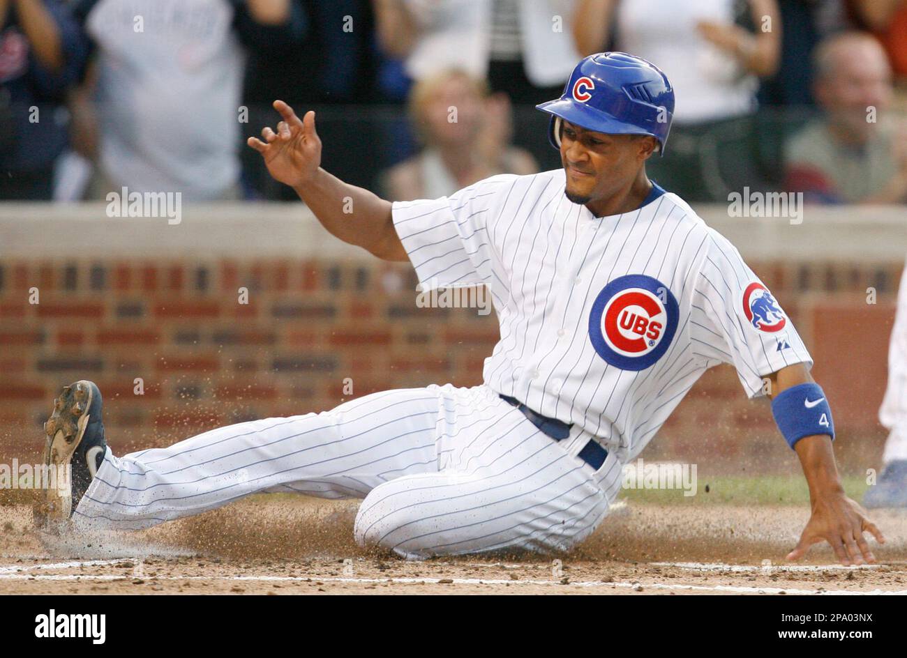 Chicago Cubs' Eric Patterson slides safely into home plate during the ...