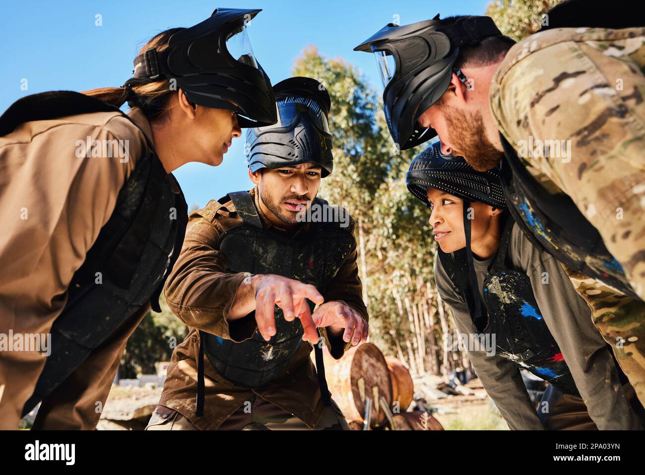 Mission, paintball or people in huddle planning strategy, teamwork or ...