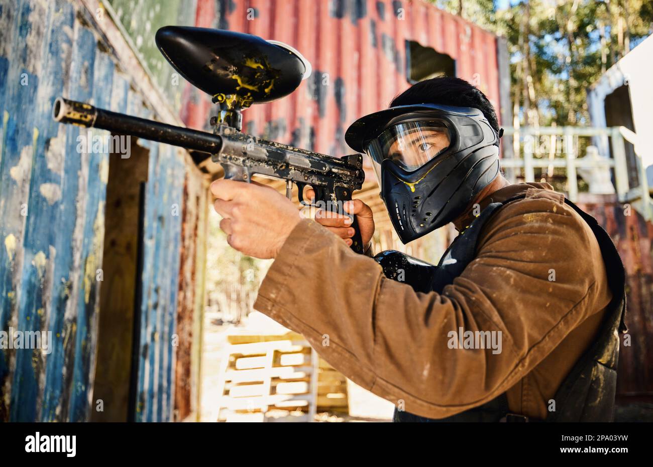 Paintball, target practice or man with gun in shooting game playing ...