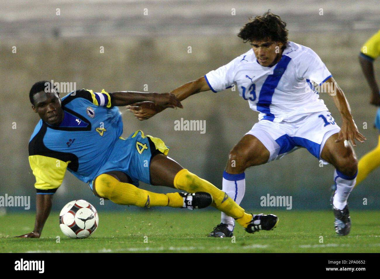 St. Lucia's Germal Varcin, left, kicks the ball away from Guatemala's ...