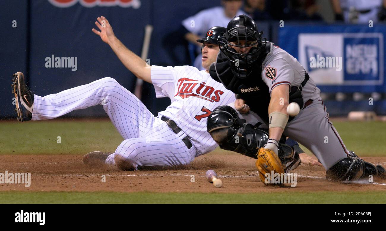 Arizona Diamondbacks catcher Chris Snyder, right, attempts to stop the ...