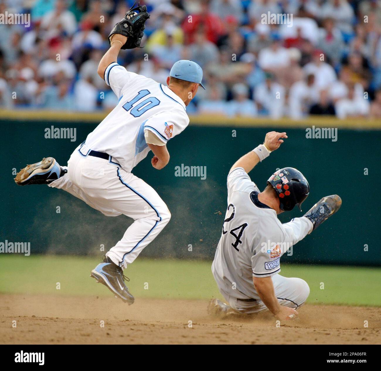 North Carolina second baseman Kyle Seager, left, tags out Fresno State ...