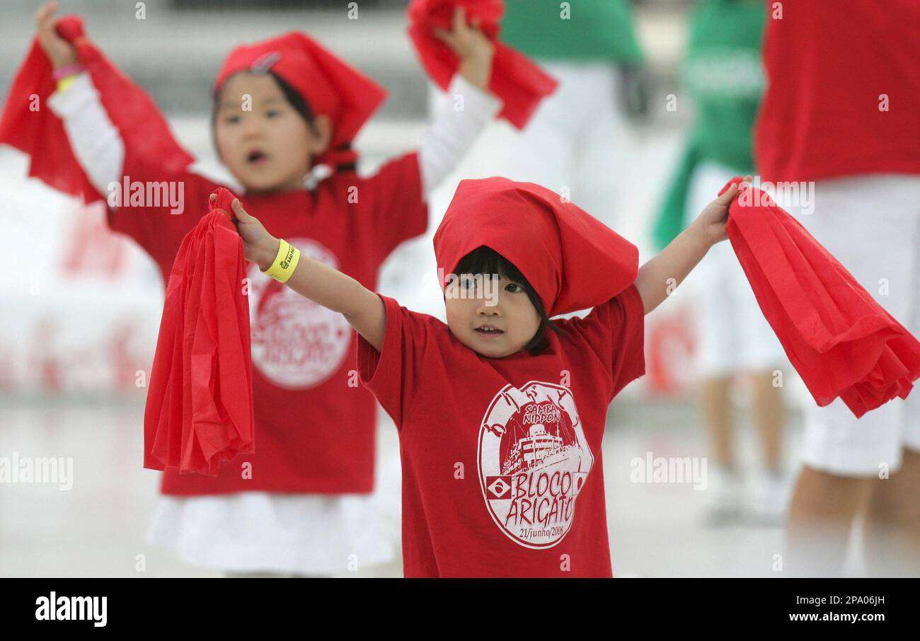 Japanese descendants perform during a ceremony marking the 100th ...