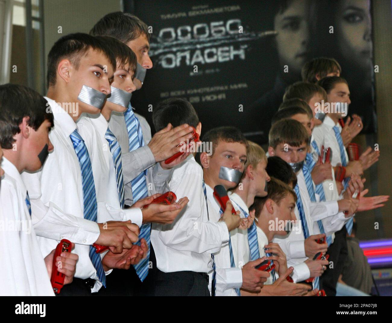 Flash mob performers stand at a film premiere of 'Wanted' by Russian ...