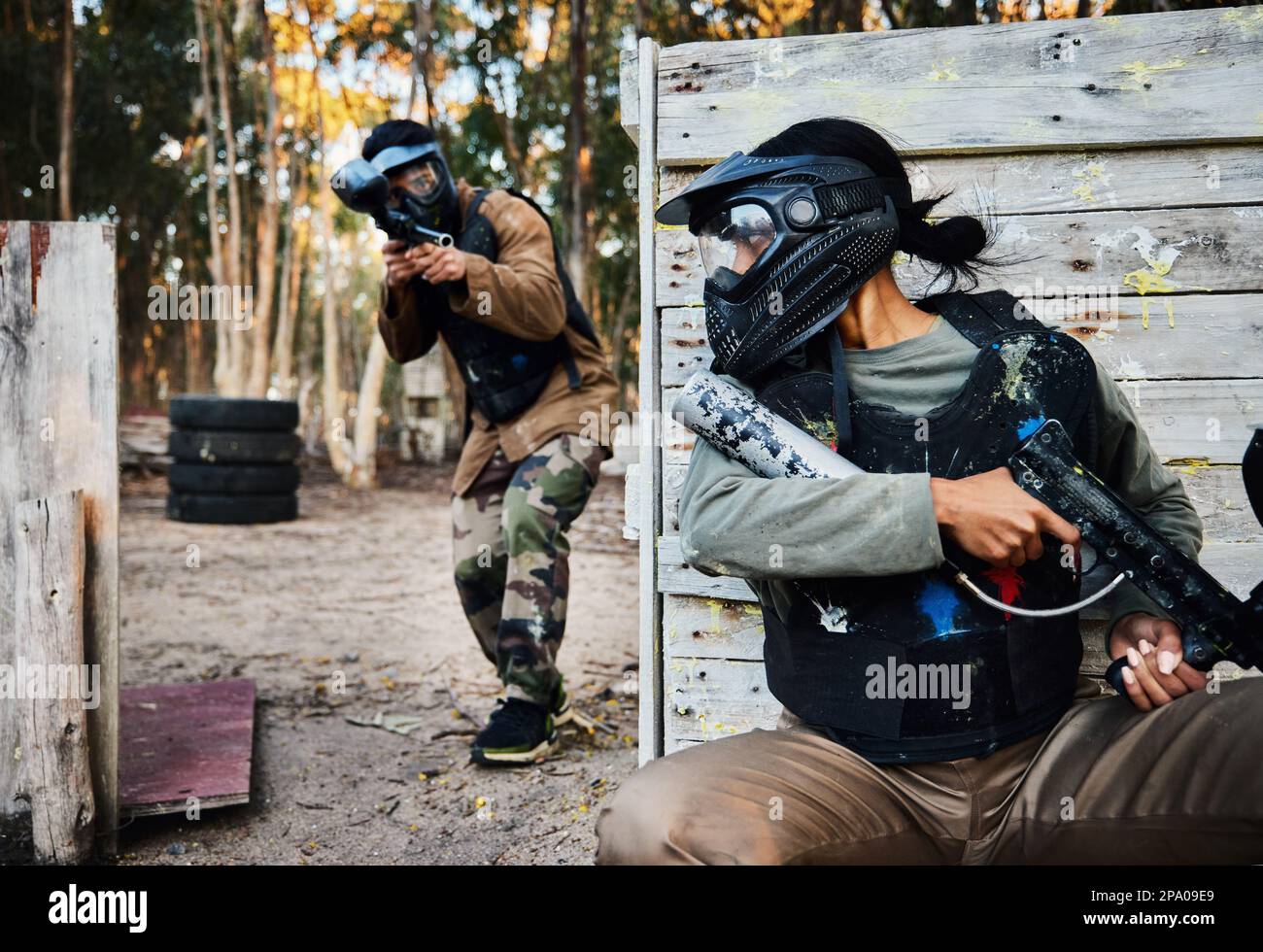 Sports, paintball and woman with gun for battle, game or competition ...