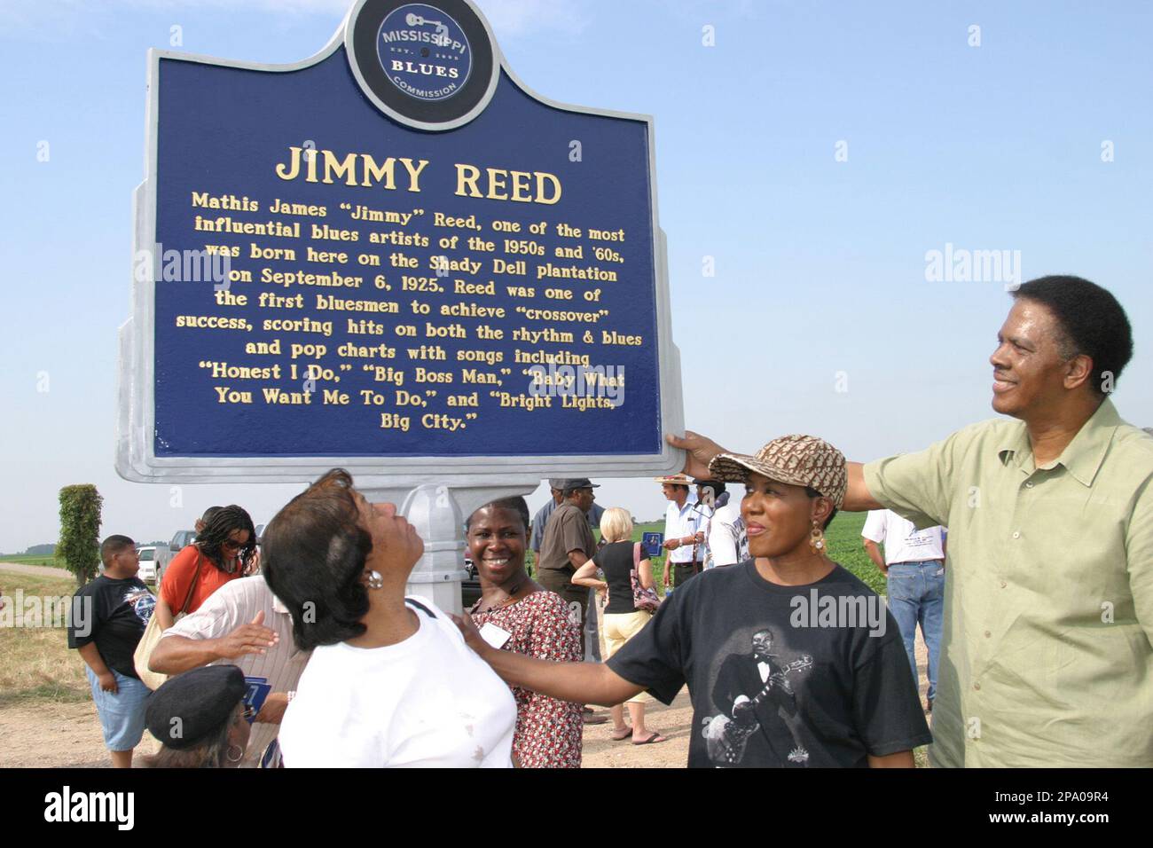 Children of the late Jimmy Reed, foreground from left, Loretta Reed ...