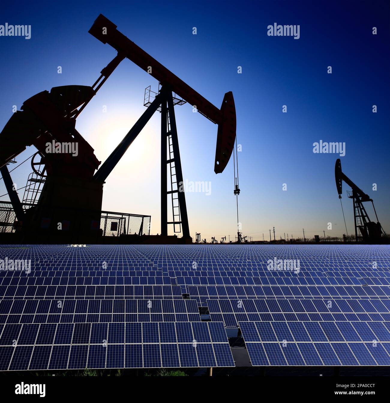 Clean power energy concept,Oil pump with solar panels and the sunset ...