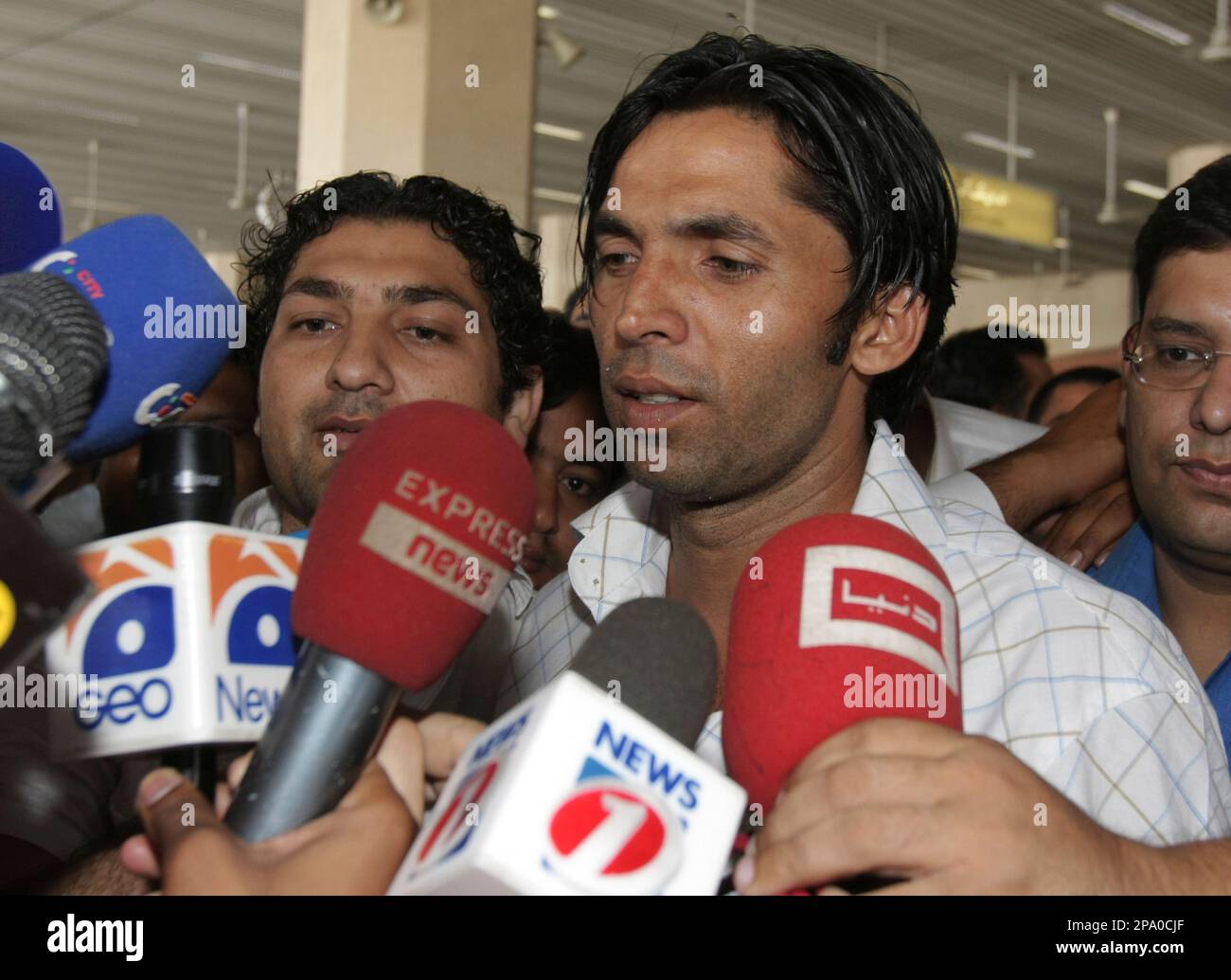 Pakistani test cricketer Mohammed Asif talks to reporters as he returns ...