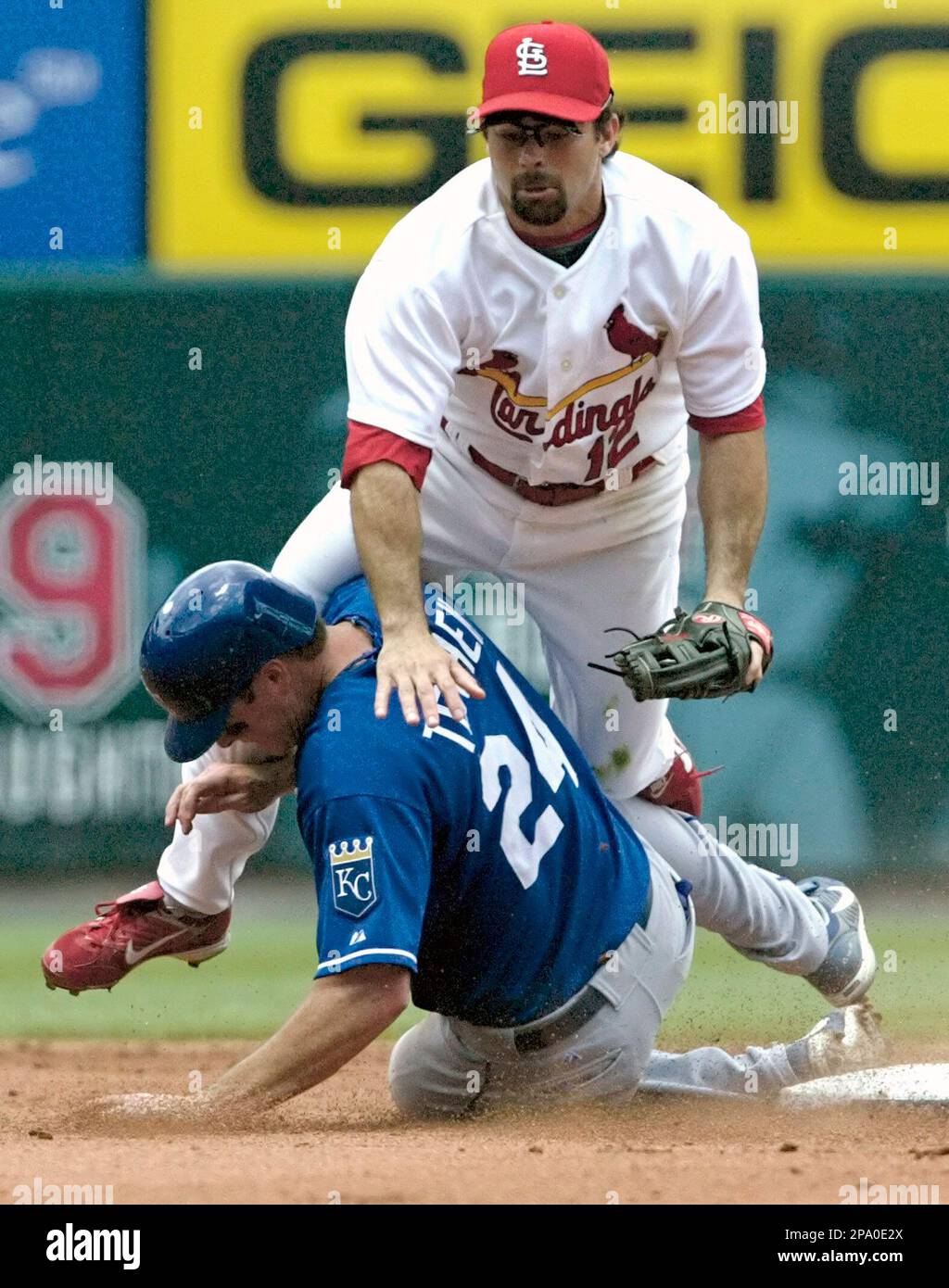 Kansas City Royals' Mark Teahen (24) slides into St. Louis Cardinals ...