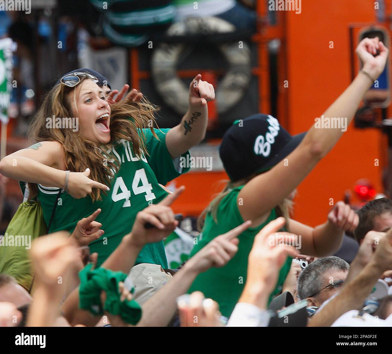 A Boston Celtics fan points to her number 44 jersey as Boston Celtics ...