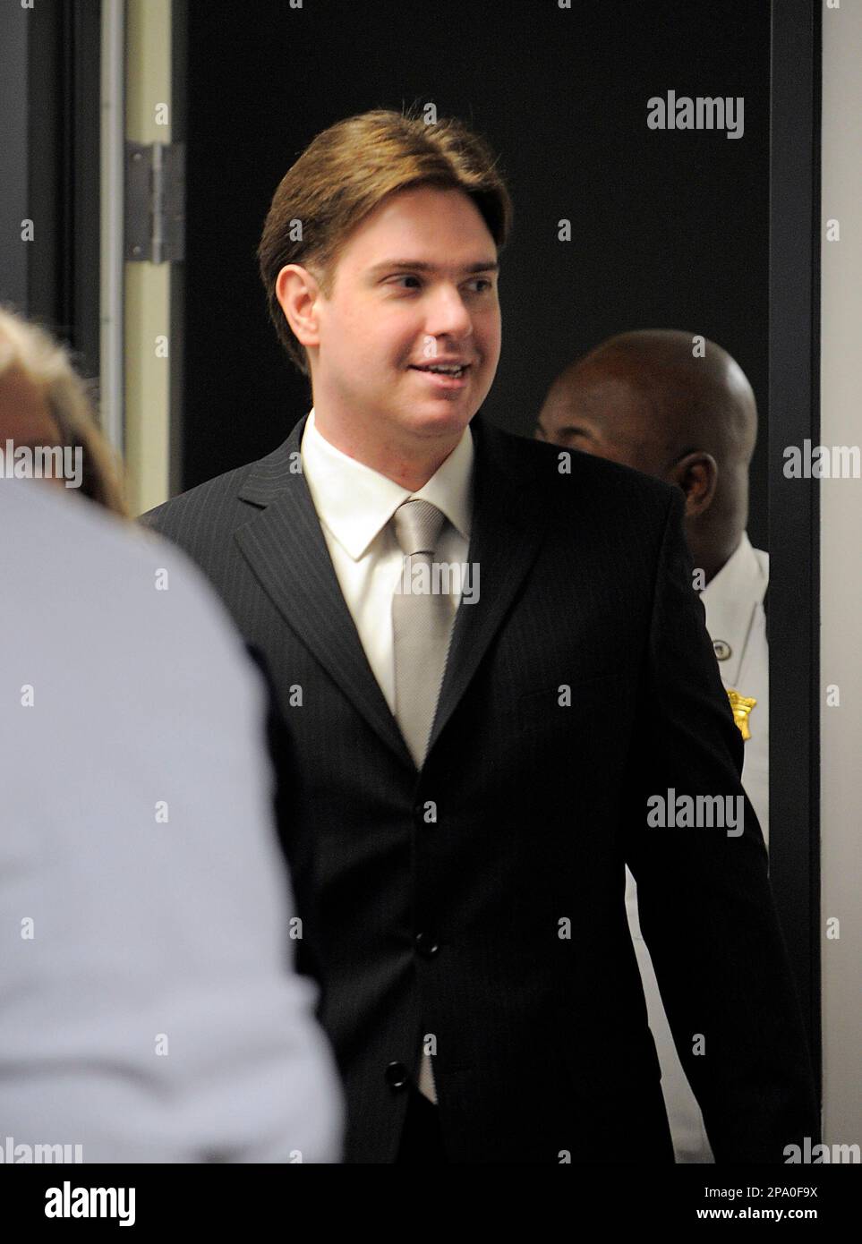 Neil Entwistle enters the courtroom and smiles to his parents at ...
