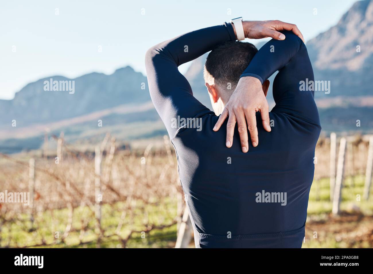 Man, stretching before run and fitness outdoor, back view with hiking ...